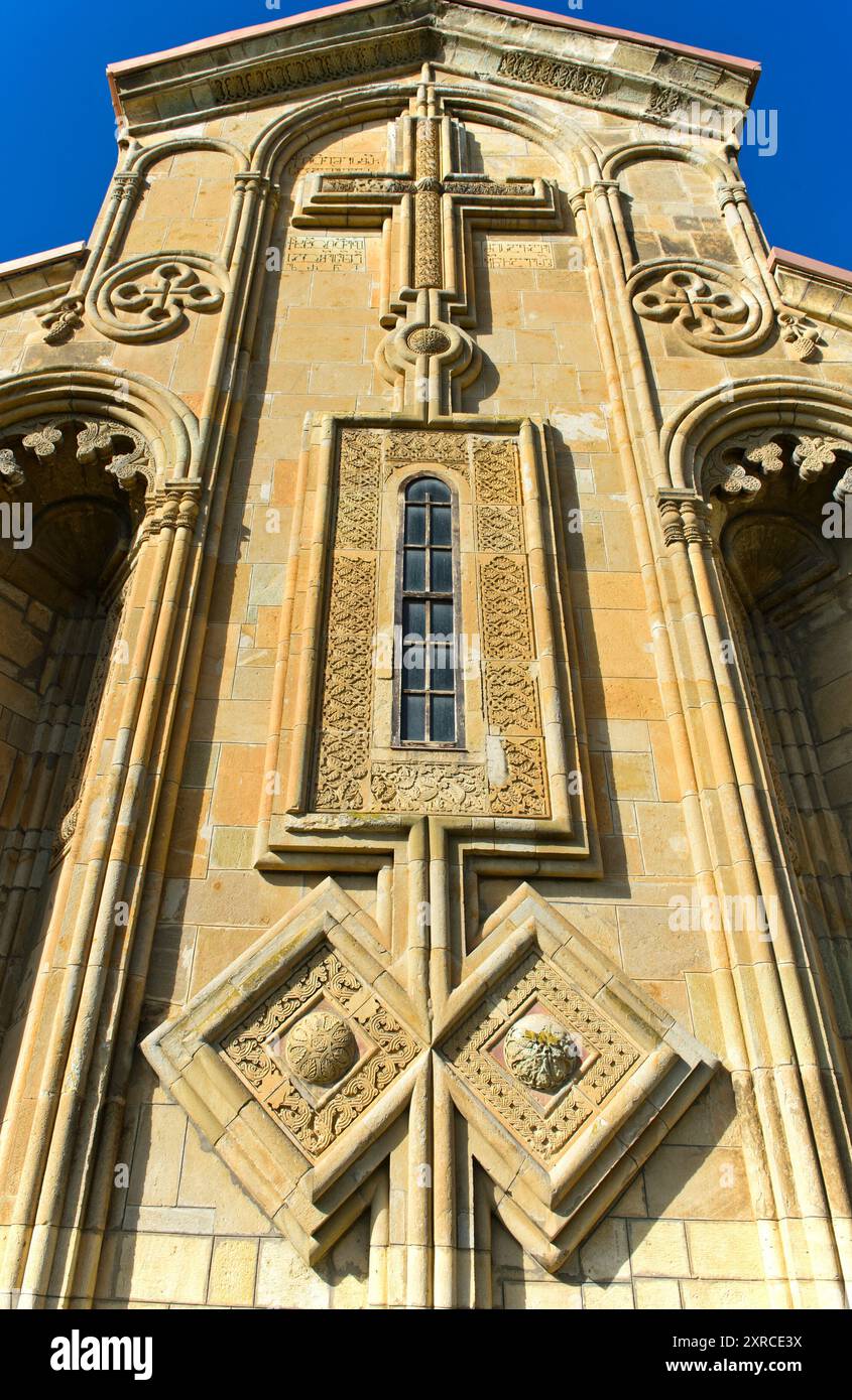 Richly decorated five-arched east facade with cross, ornamented window ...
