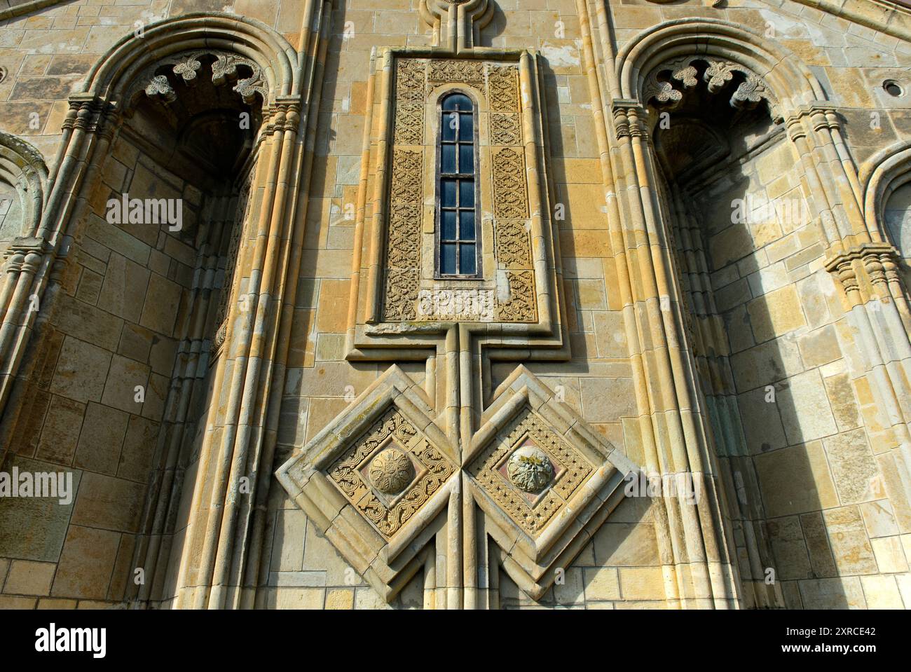 Richly decorated five-arched east facade with ornamented window and two ...