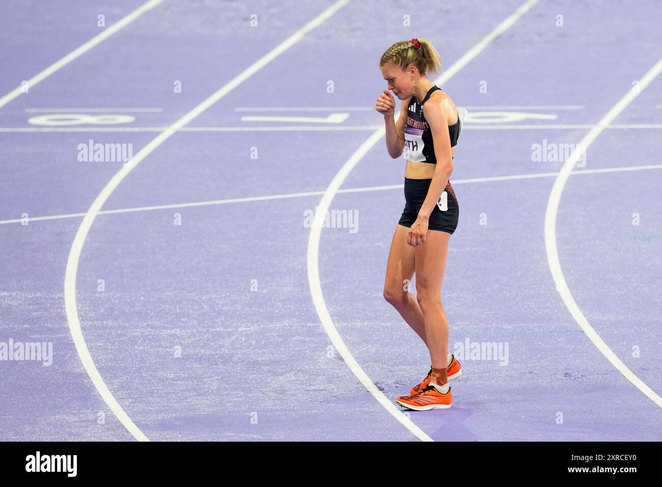 Megan Keith, of Britain, reacts after the women's 10,000-meter run at ...