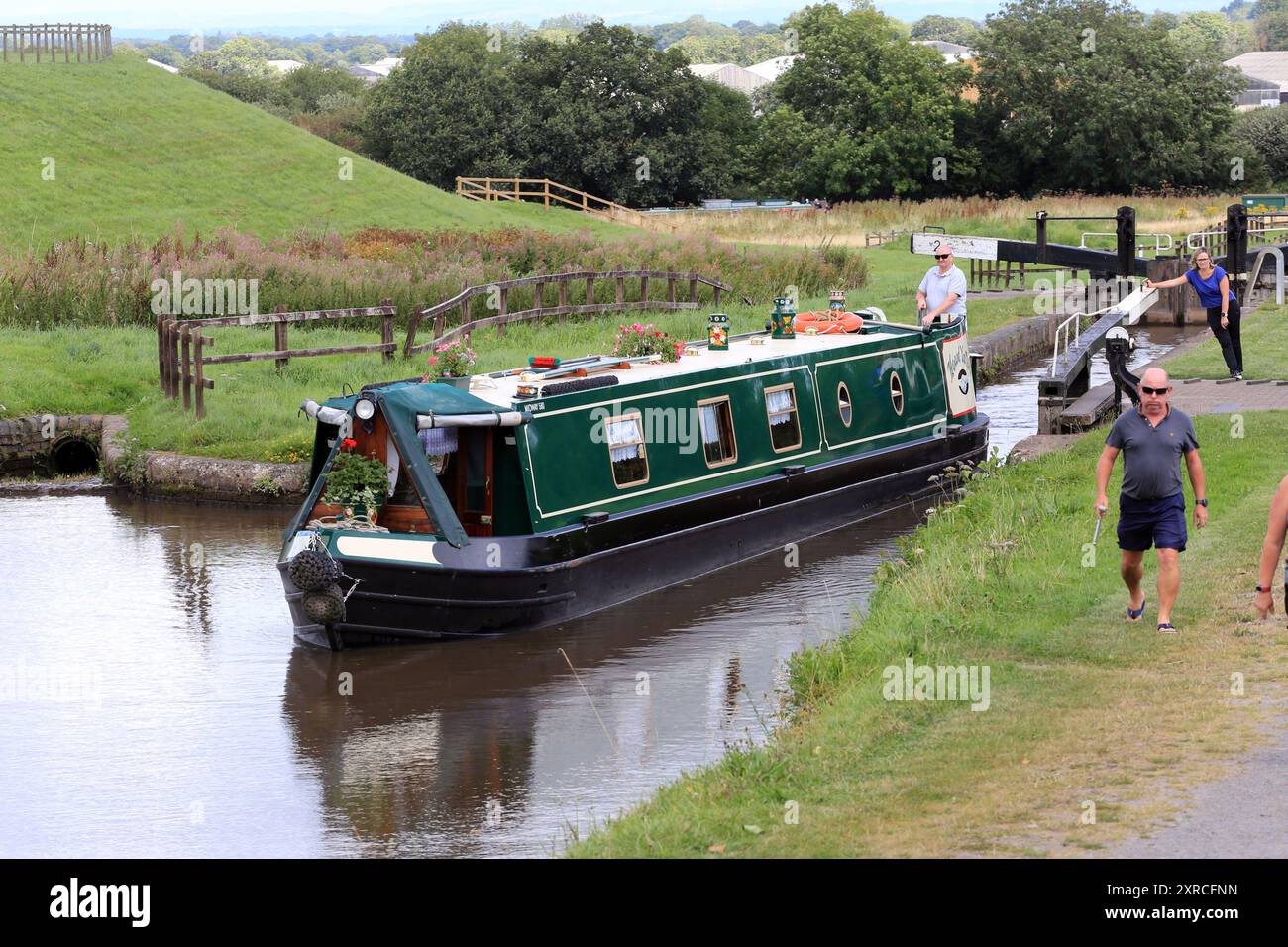 People on canal narrowboats, passing through Hurleston locks on the ...