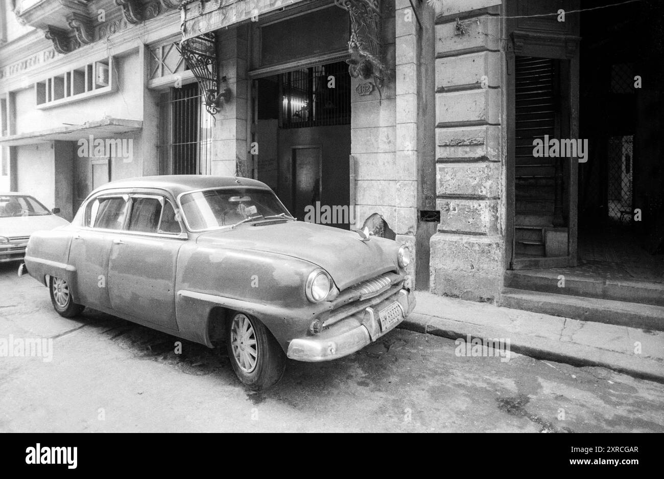 2001 black & white archive photograph of old American car outside a ...