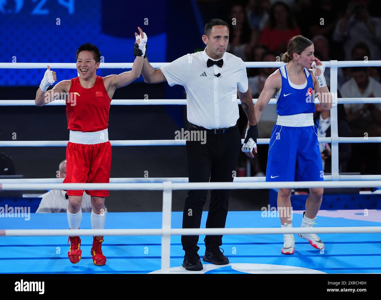 China’s Yu Wu (left) celebrates her victory over Turkey’s Buse Naz ...