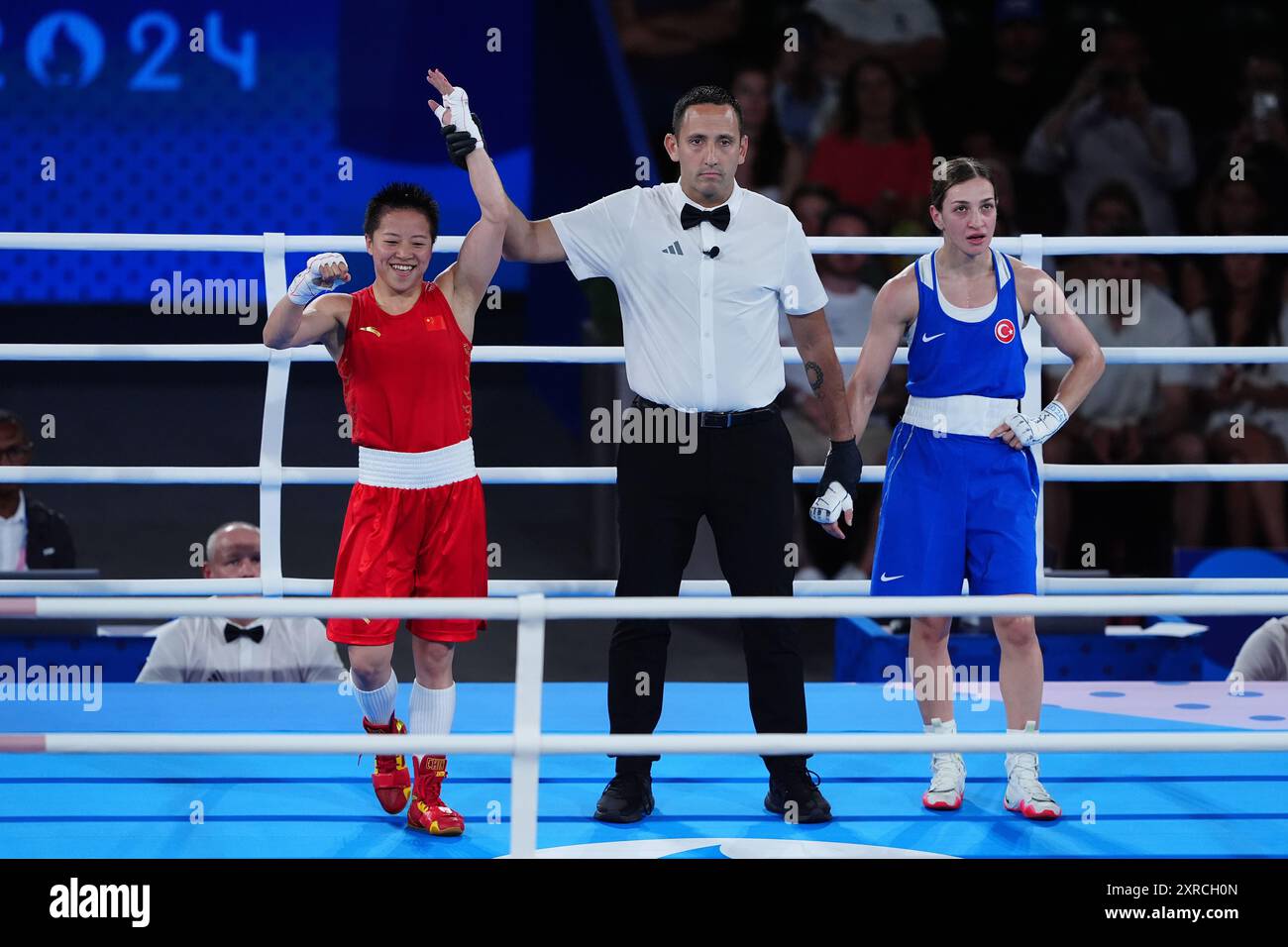 China’s Yu Wu (left) celebrates her victory over Turkey’s Buse Naz ...