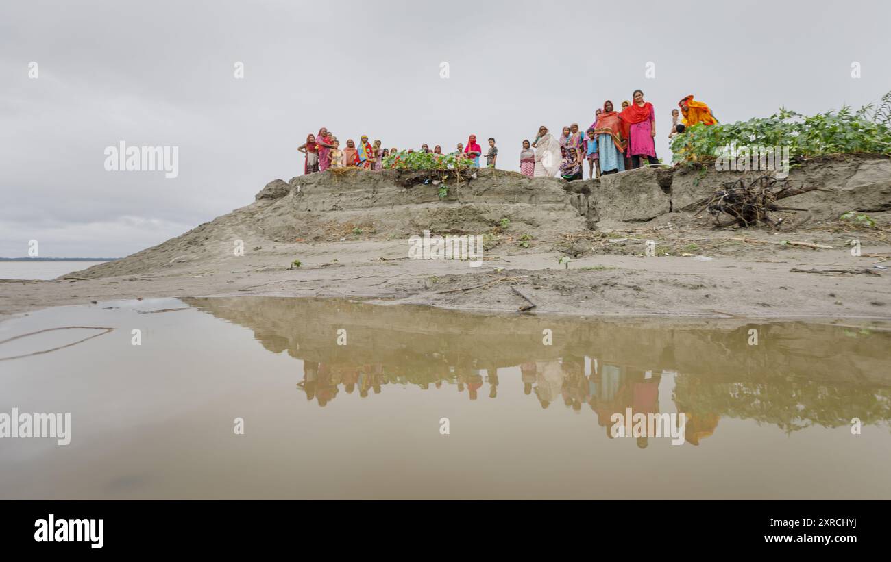 Women and children of the Nayer char on the river bank of Brahmaputra ...