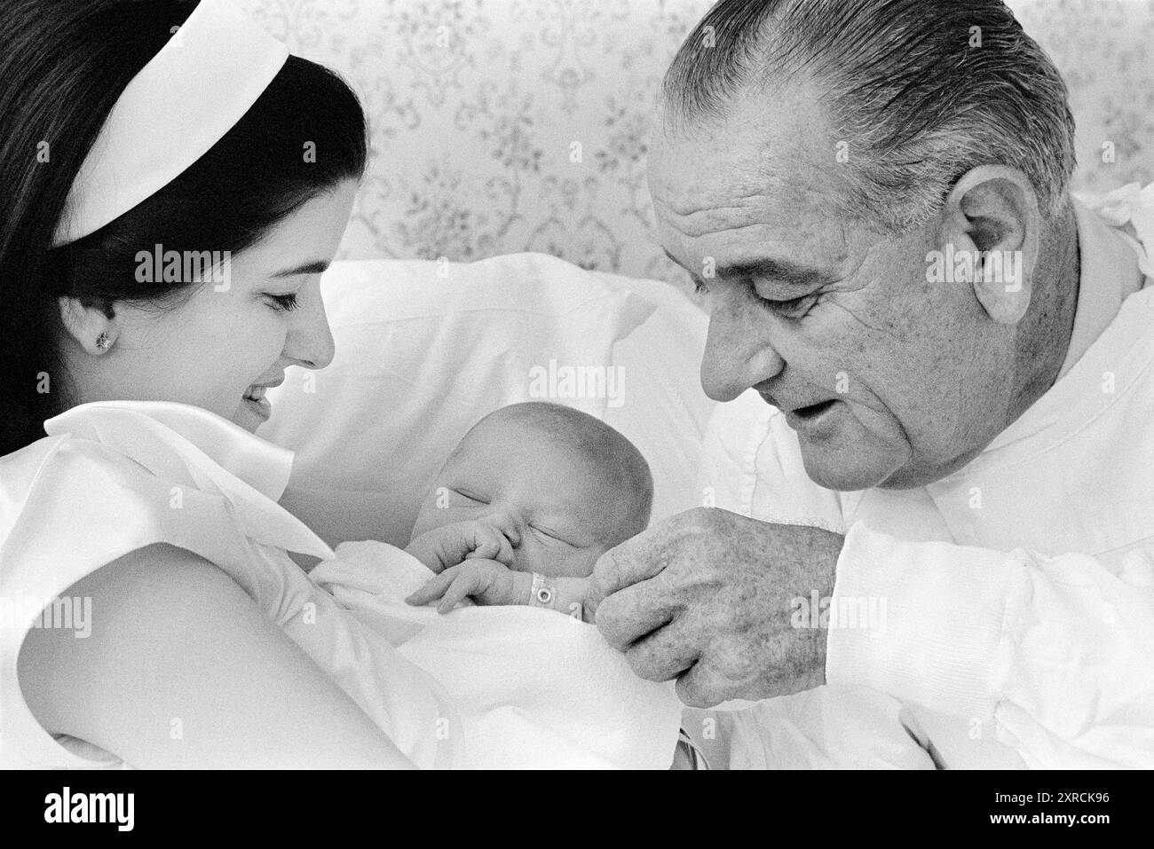 U.S. President Lyndon B. Johnson visiting daughter Luci Johnson Nugent and first grandchild ...