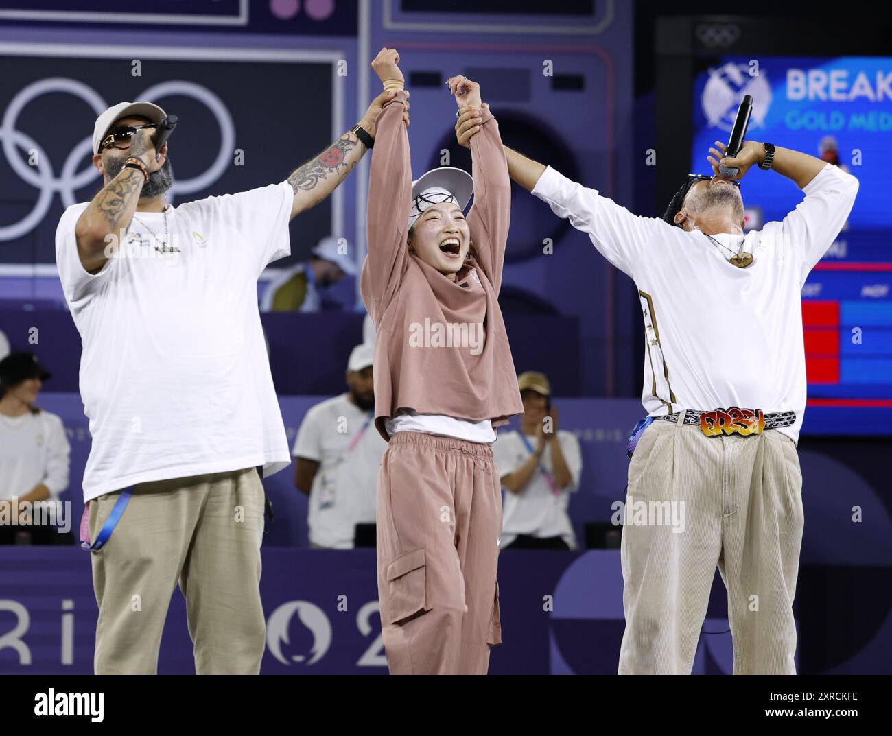Japan's Ami Yuasa (C) celebrates after winning the women's breaking ...