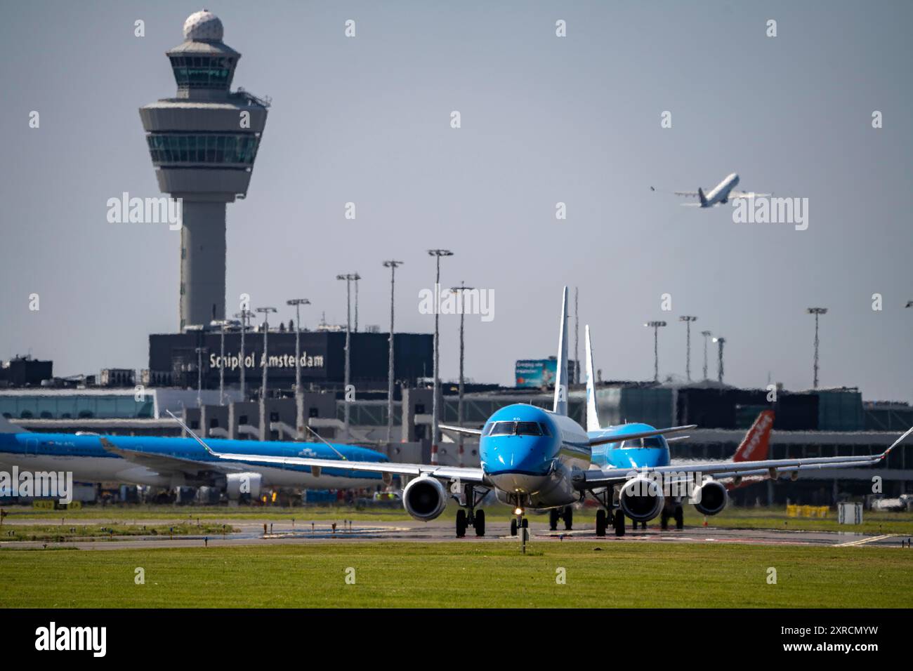 Aircraft at Amsterdam Schiphol Airport, on the taxiway for take-off on ...