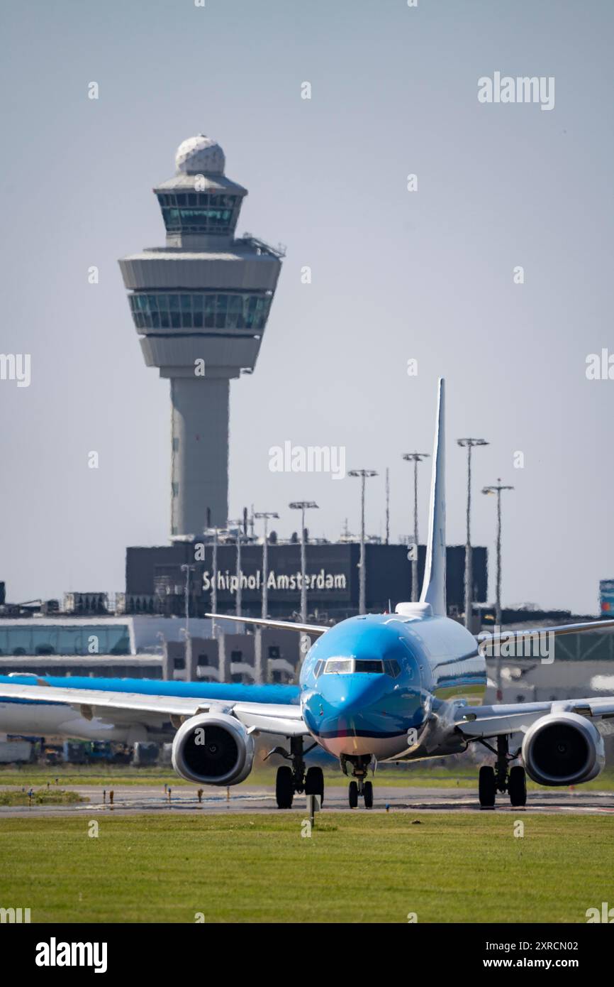 Aircraft at Amsterdam Schiphol Airport, on the taxiway for take-off on ...
