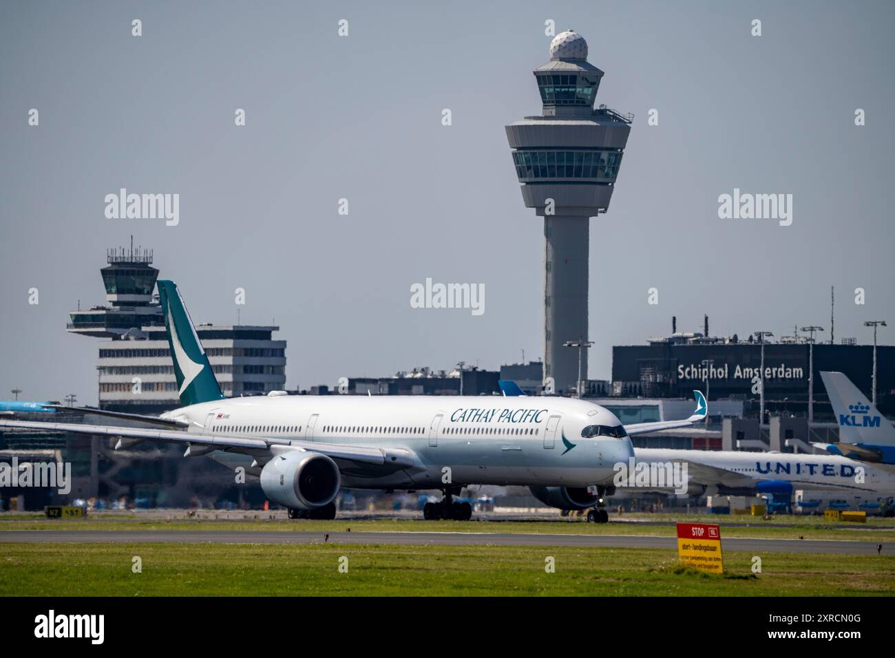 Cathay Pacific aircraft at Amsterdam Schiphol Airport, on the taxiway ...