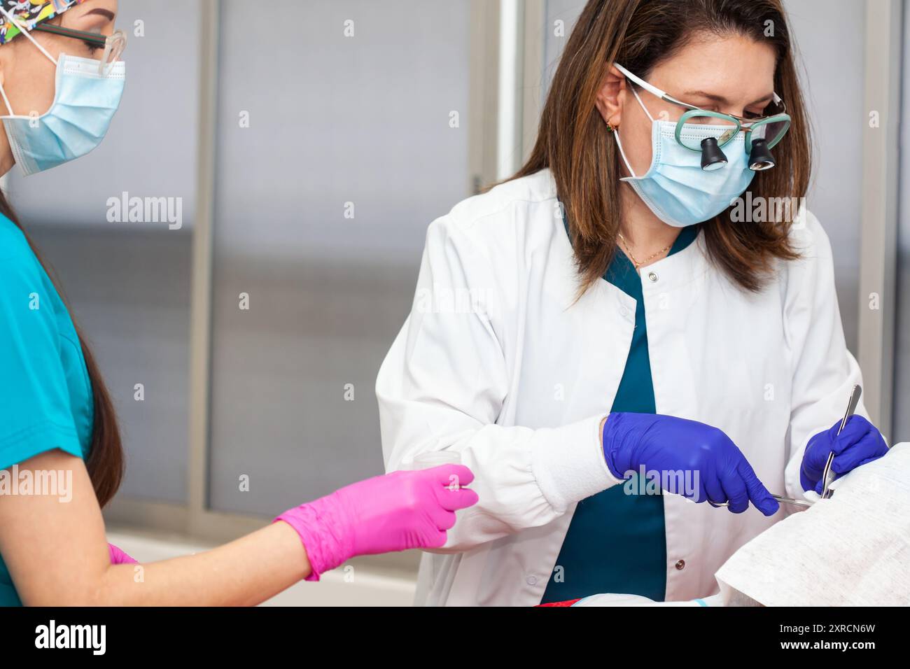 Skin lesion removal procedure. Dermatologist carrying out a removal of ...