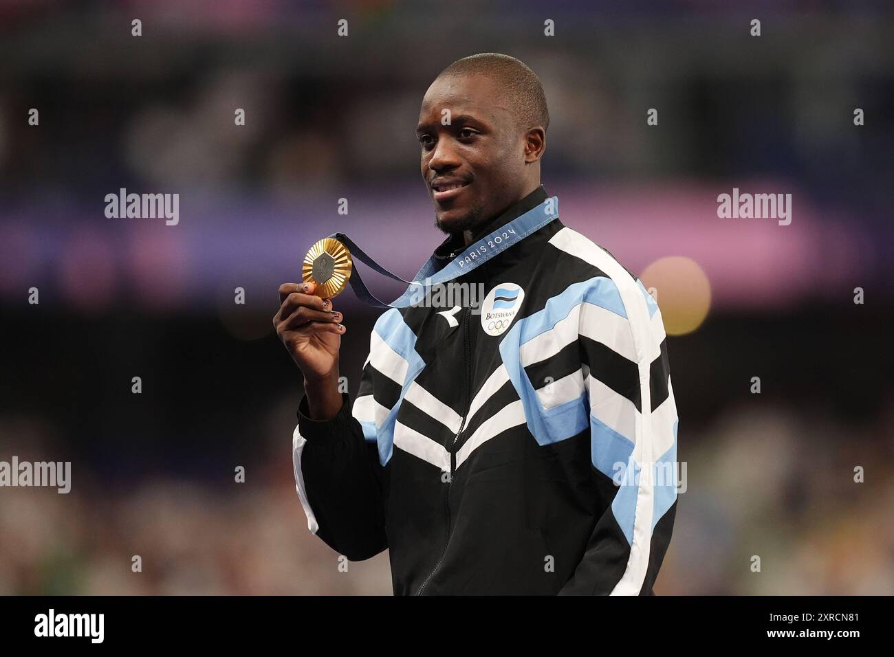 Botswana's Letsile Tebogo celebrates with his gold medal during the ...