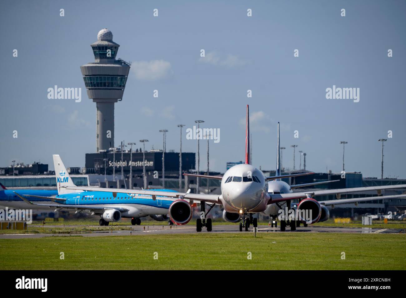 Aircraft at Amsterdam Schiphol Airport, on the taxiway for take-off on ...