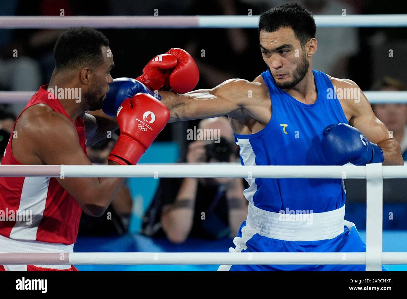 Azerbaijan's Loren Alfonso, left, fights Uzbekistan's Lazizbek ...