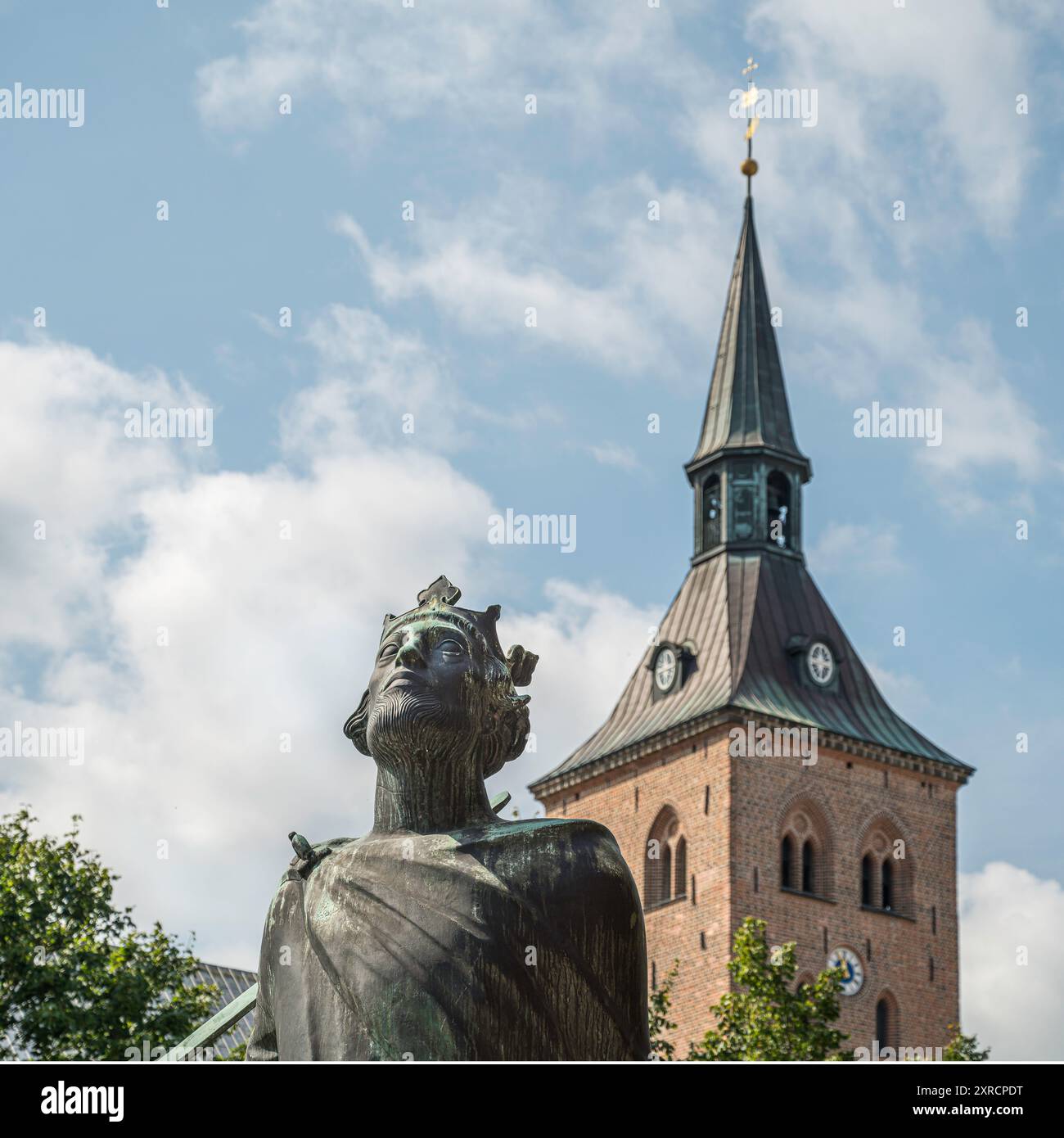 the bronze monument of Saint Canute lokking in the sky, in front of the ...