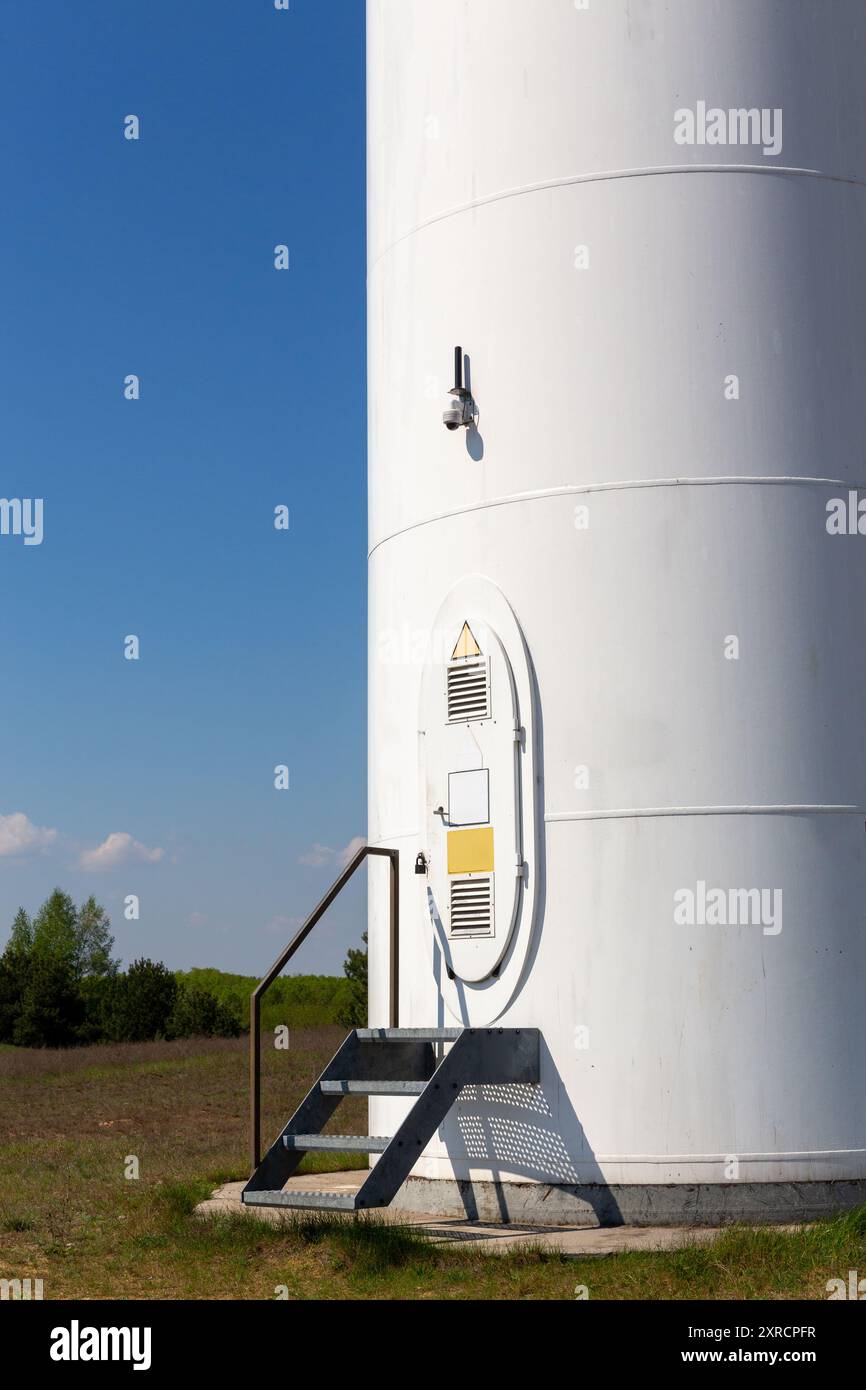 Door in the base of a wind turbine. Entrance door at base of wind ...
