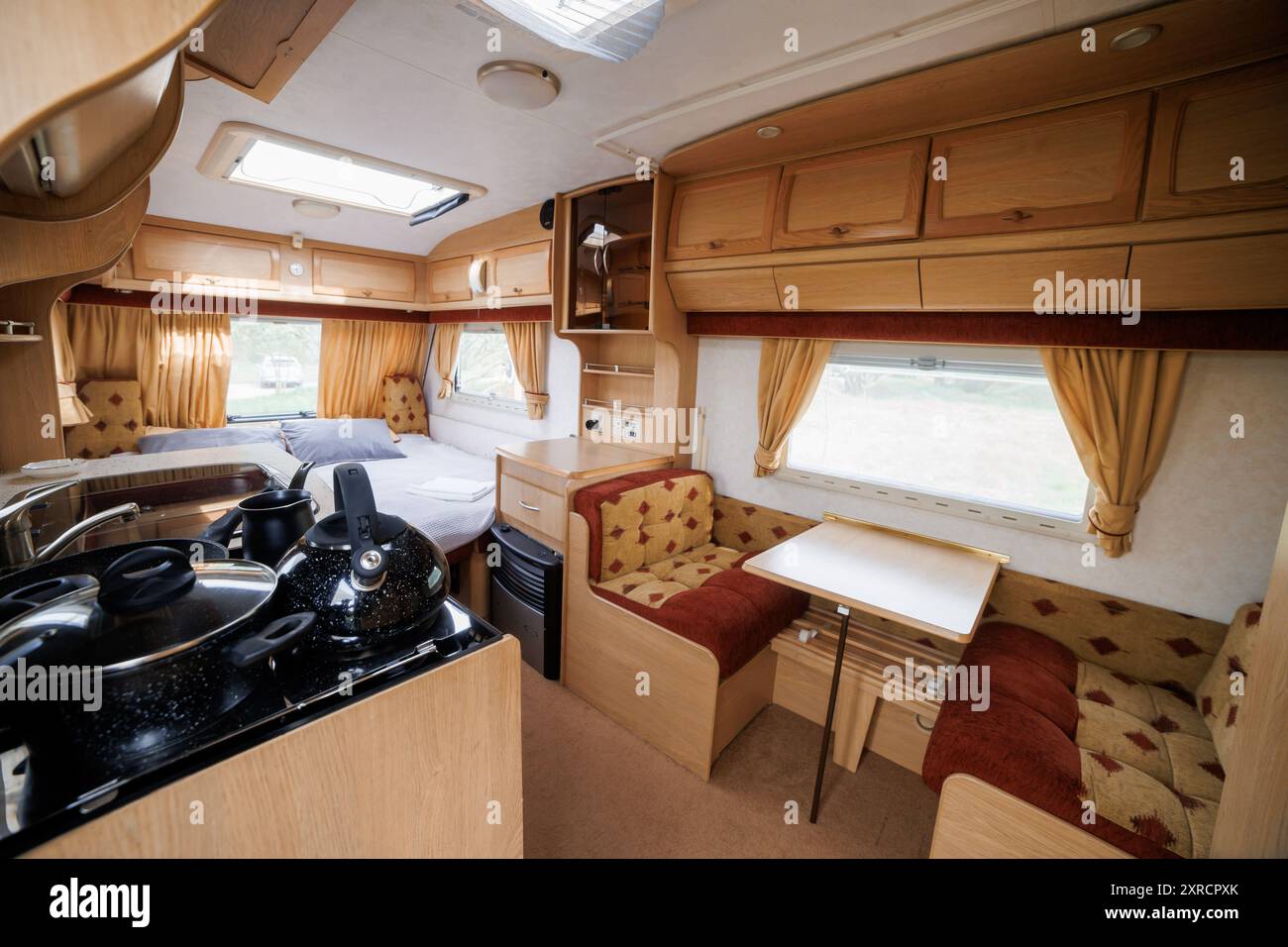 Cozy Caravan Interior with Kitchen and Sleeping Area. Ideal for ...