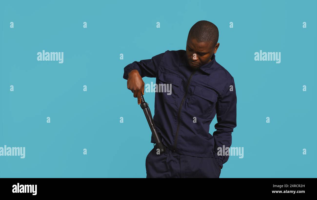 Portrait of security staff member tasked with evicting trespassers ...