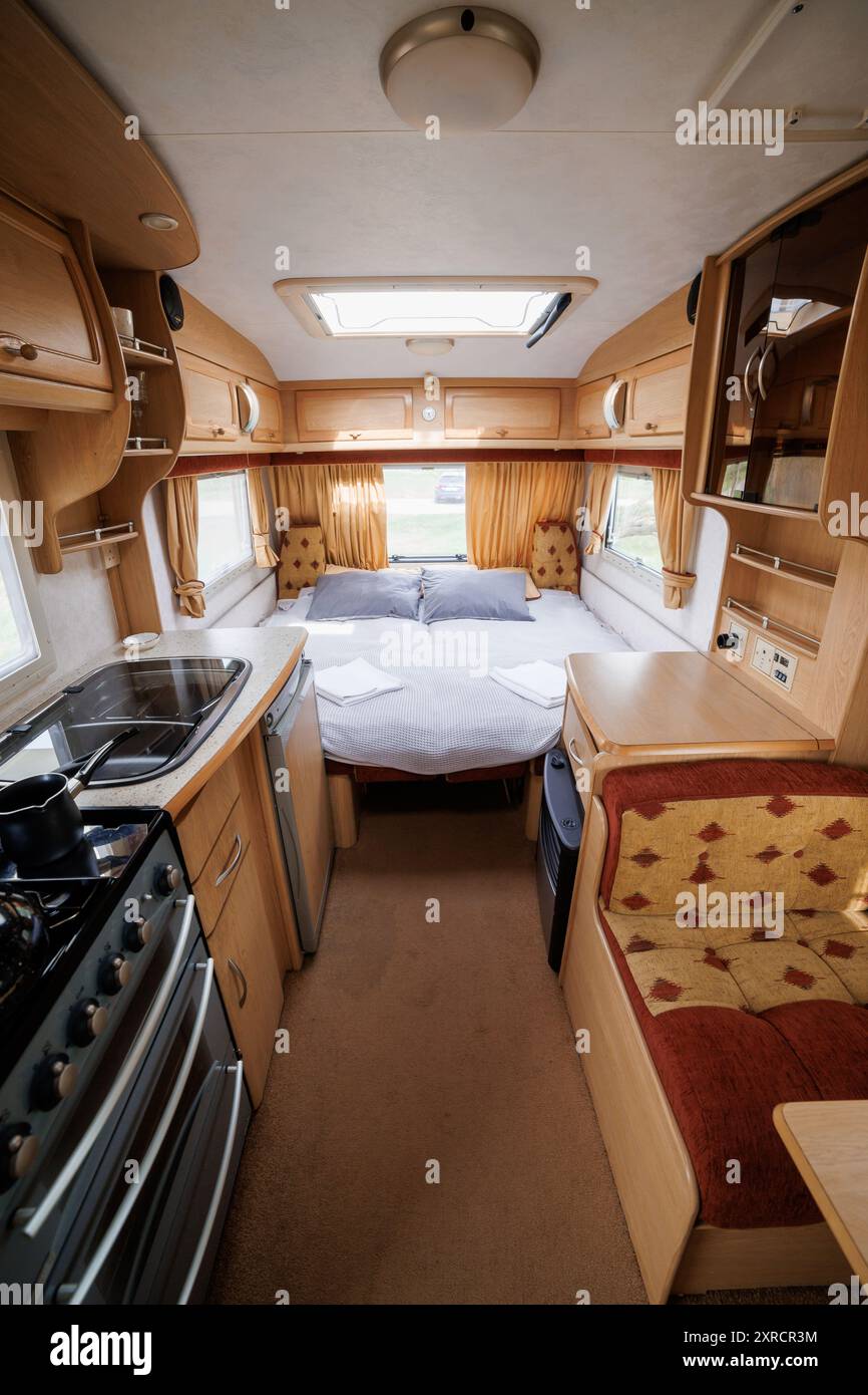 Cozy Caravan Interior with Kitchen and Sleeping Area. Ideal for ...