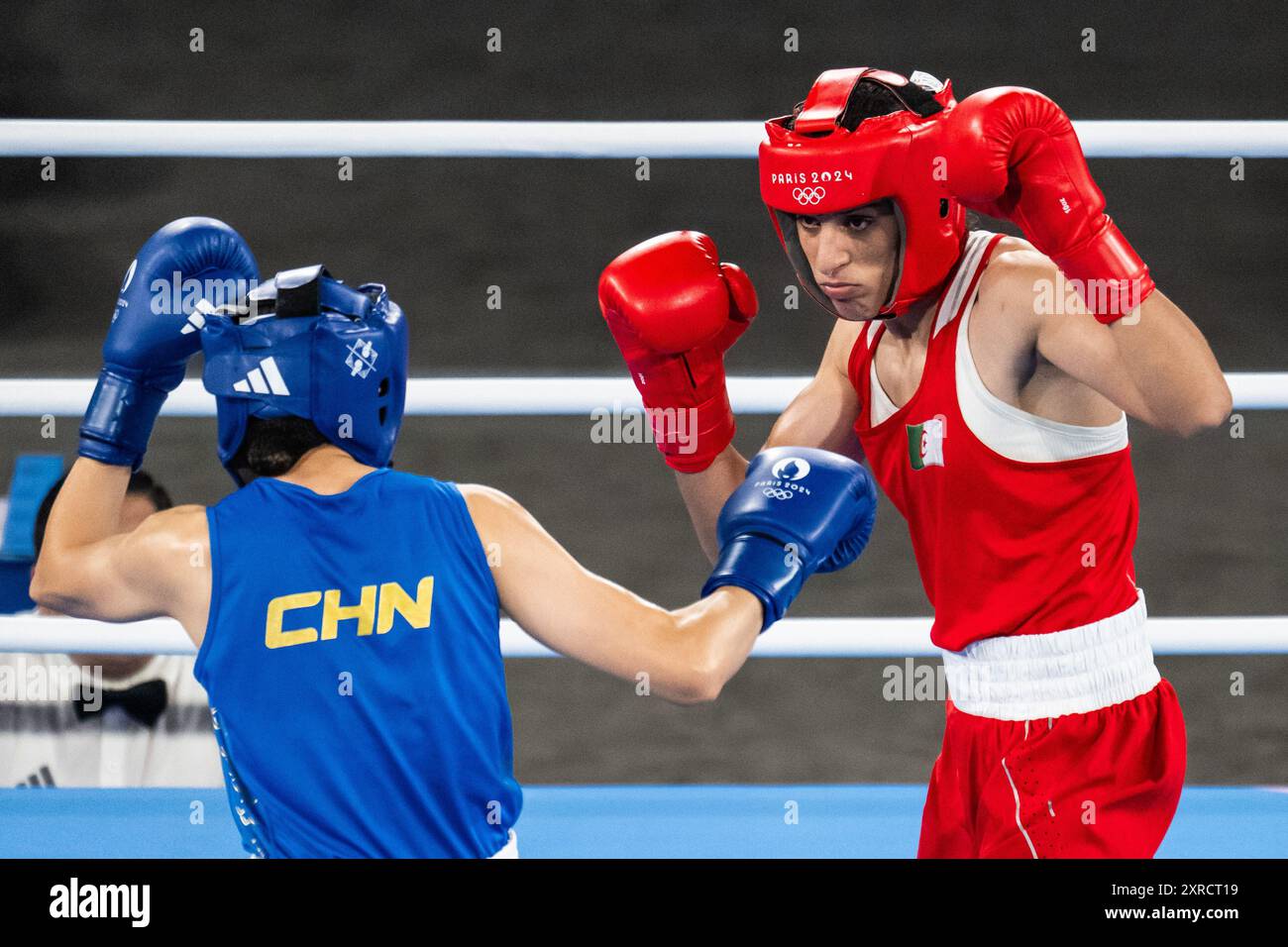 Imane Khelif of, Algeria. , . (red) vs Liu Yang of China (blue) in ...