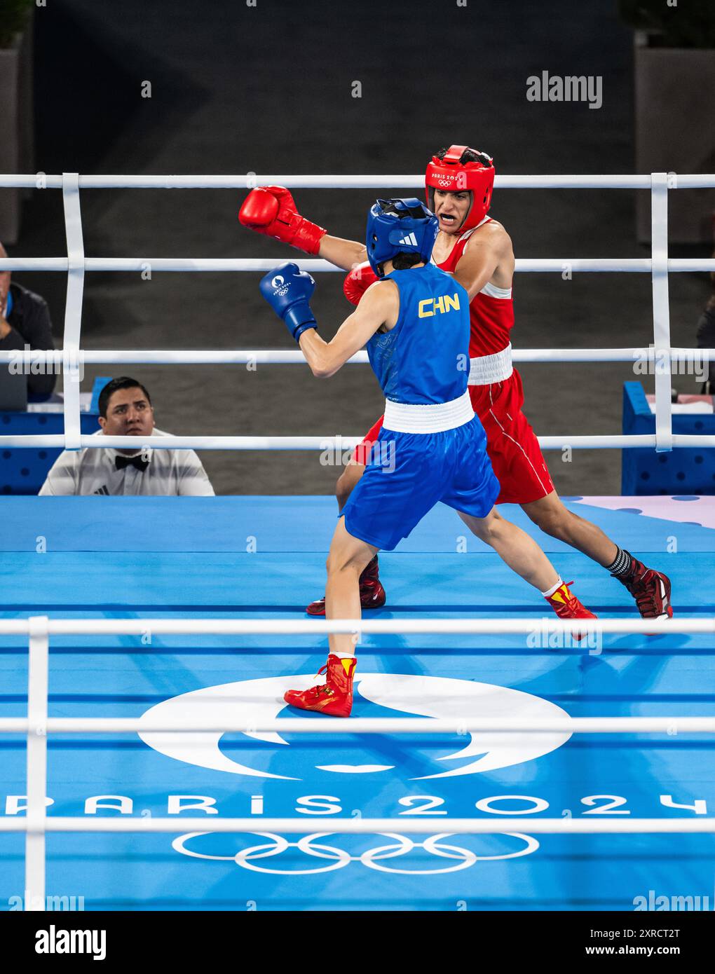 Imane Khelif of, Algeria. , . (red) vs Liu Yang of China (blue) in ...