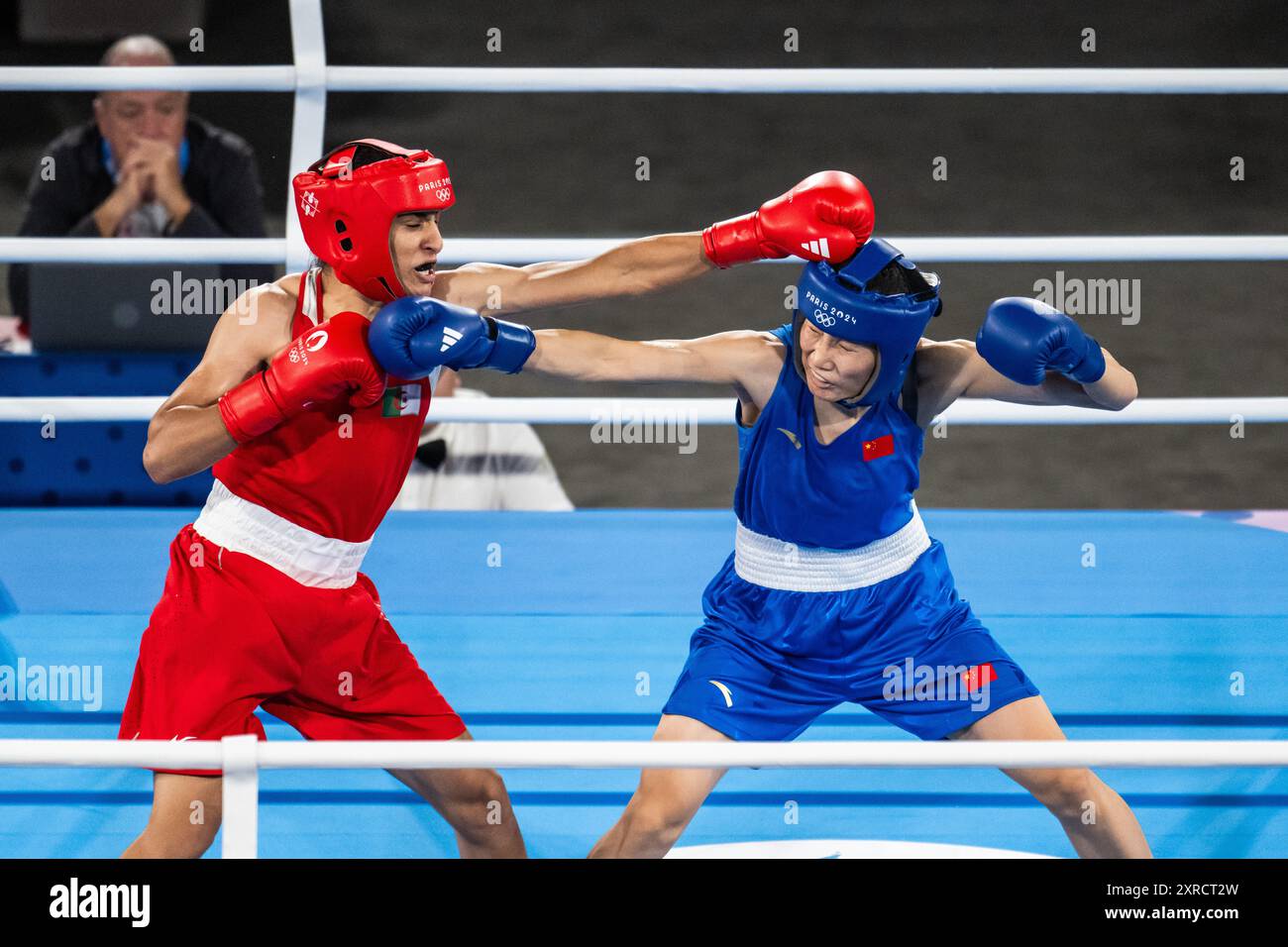 Imane Khelif of, Algeria. , . (red) vs Liu Yang of China (blue) in ...