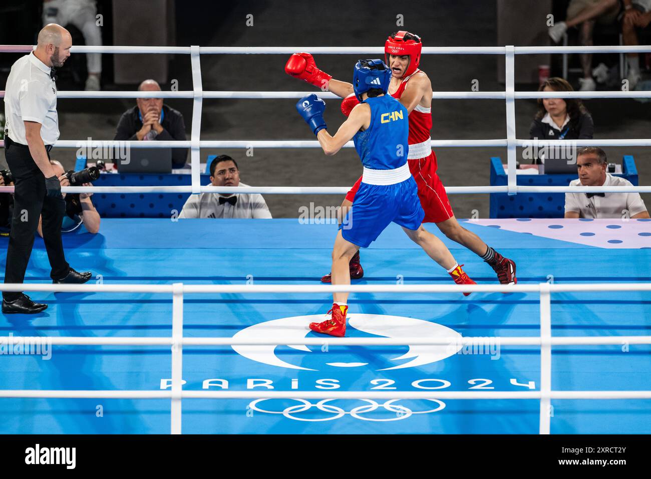Imane Khelif of, Algeria. , . (red) vs Liu Yang of China (blue) in ...