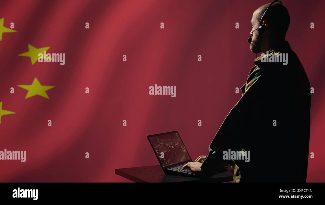 Chinese army communication systems operator using radio and satellite equipment, providing ...