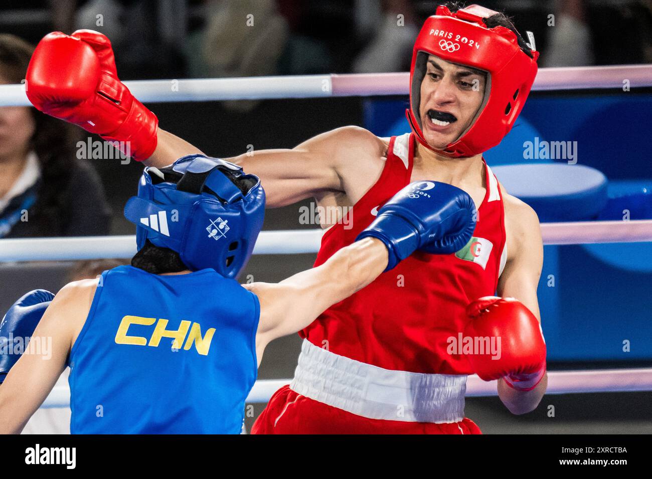 Imane Khelif of, Algeria. , . (red) vs Liu Yang of China (blue) in ...
