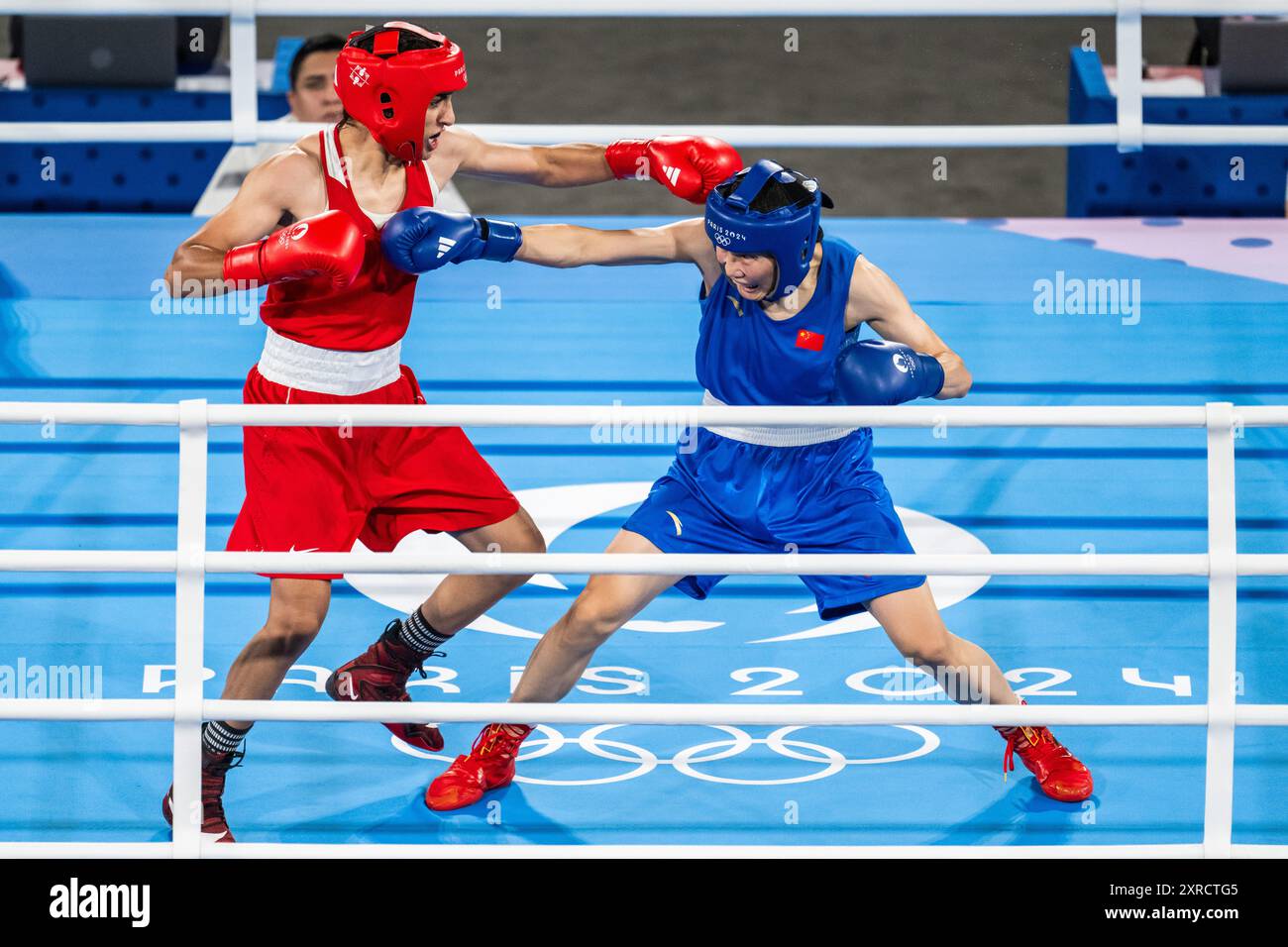 Imane Khelif of, Algeria. , . (red) vs Liu Yang of China (blue) in ...