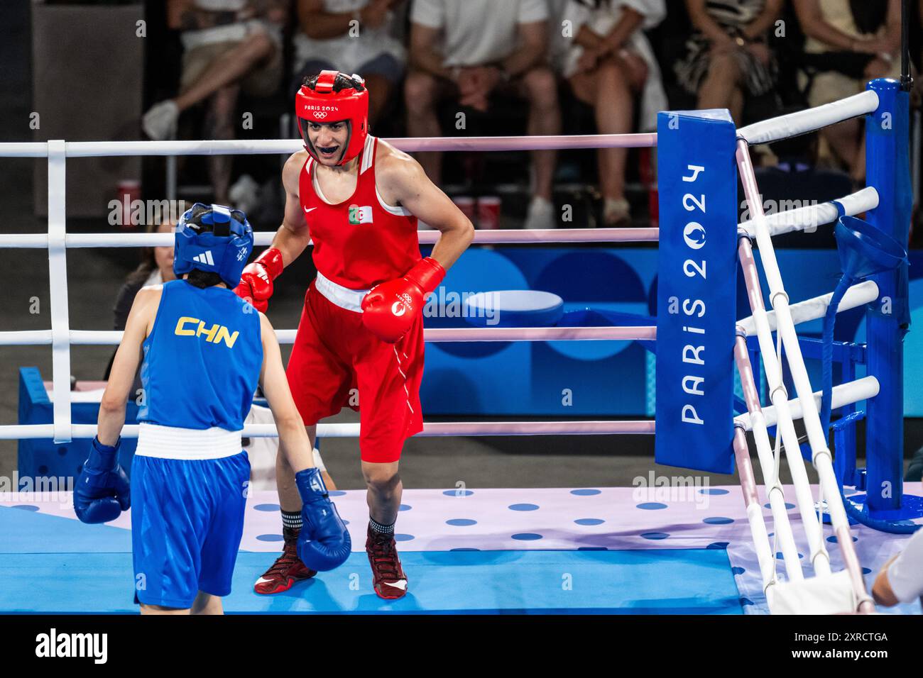 Imane Khelif of, Algeria. , . (red) vs Liu Yang of China (blue) in ...