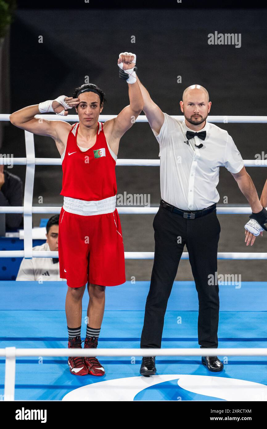 Imane Khelif of, Algeria. , . (red) celebrates after winning against ...