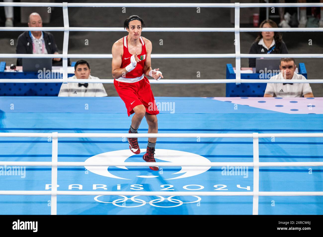 Imane Khelif of, Algeria. , . (red) celebrates after winning against ...