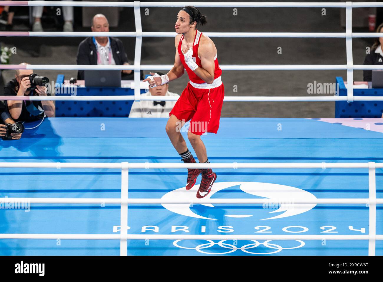 Imane Khelif of, Algeria. , . (red) celebrates after winning against ...