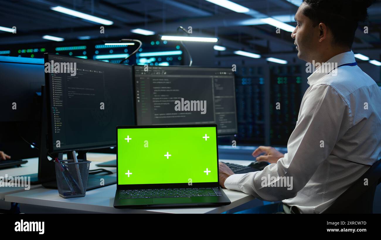 Admin In Data Center Using Isolated Screen Laptop To Design Implement And Manage Gear Ensuring