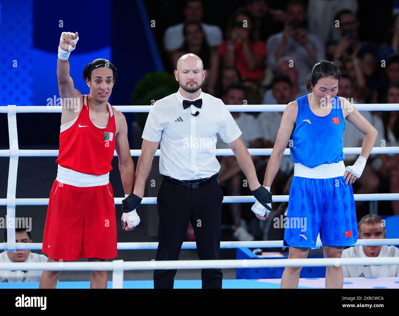 Algeria’s Imane Khelif (left) celebrates victory over China’s Liu Yang ...