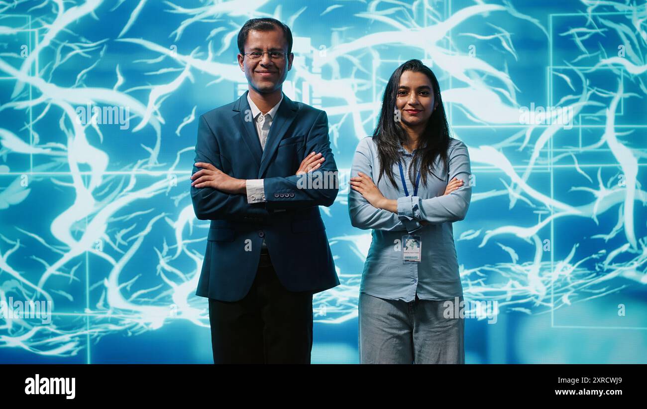 Portrait of cheerful team of admins using artificial intelligence computing simulating human ...