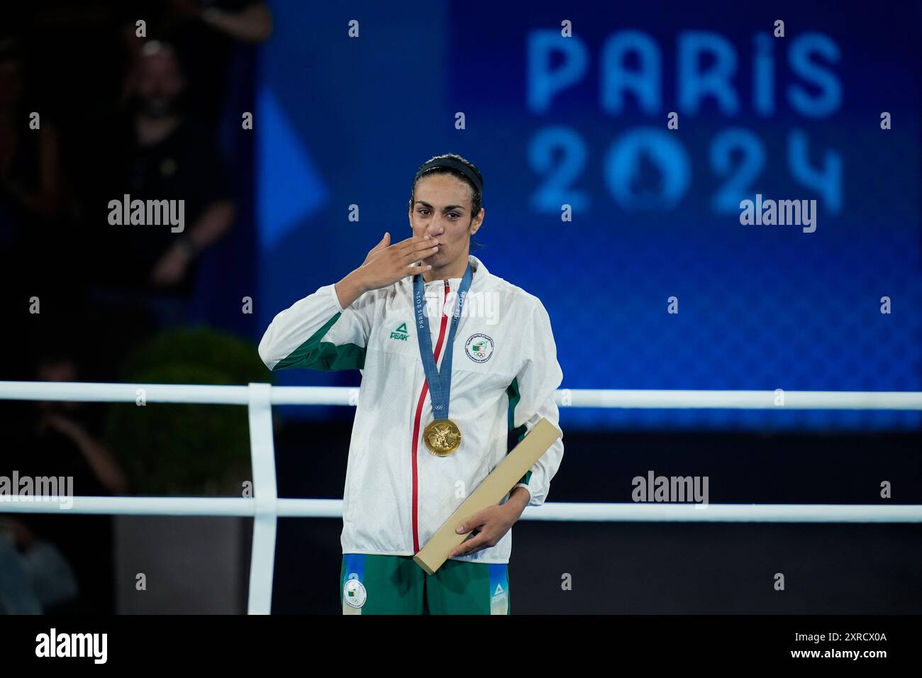 Gold medalist Algeria's Imane Khelif gestures during a medals ceremony ...