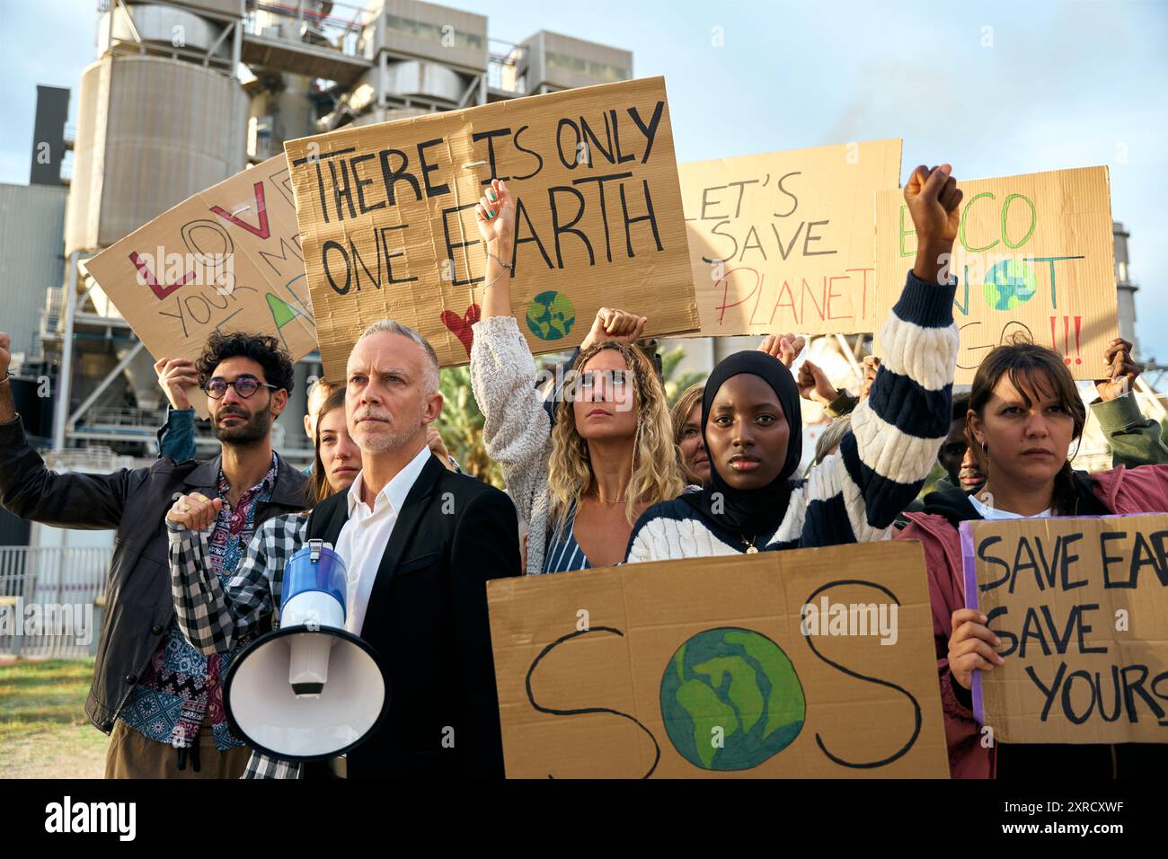 Group of activist people from different ages gathered to protest ...