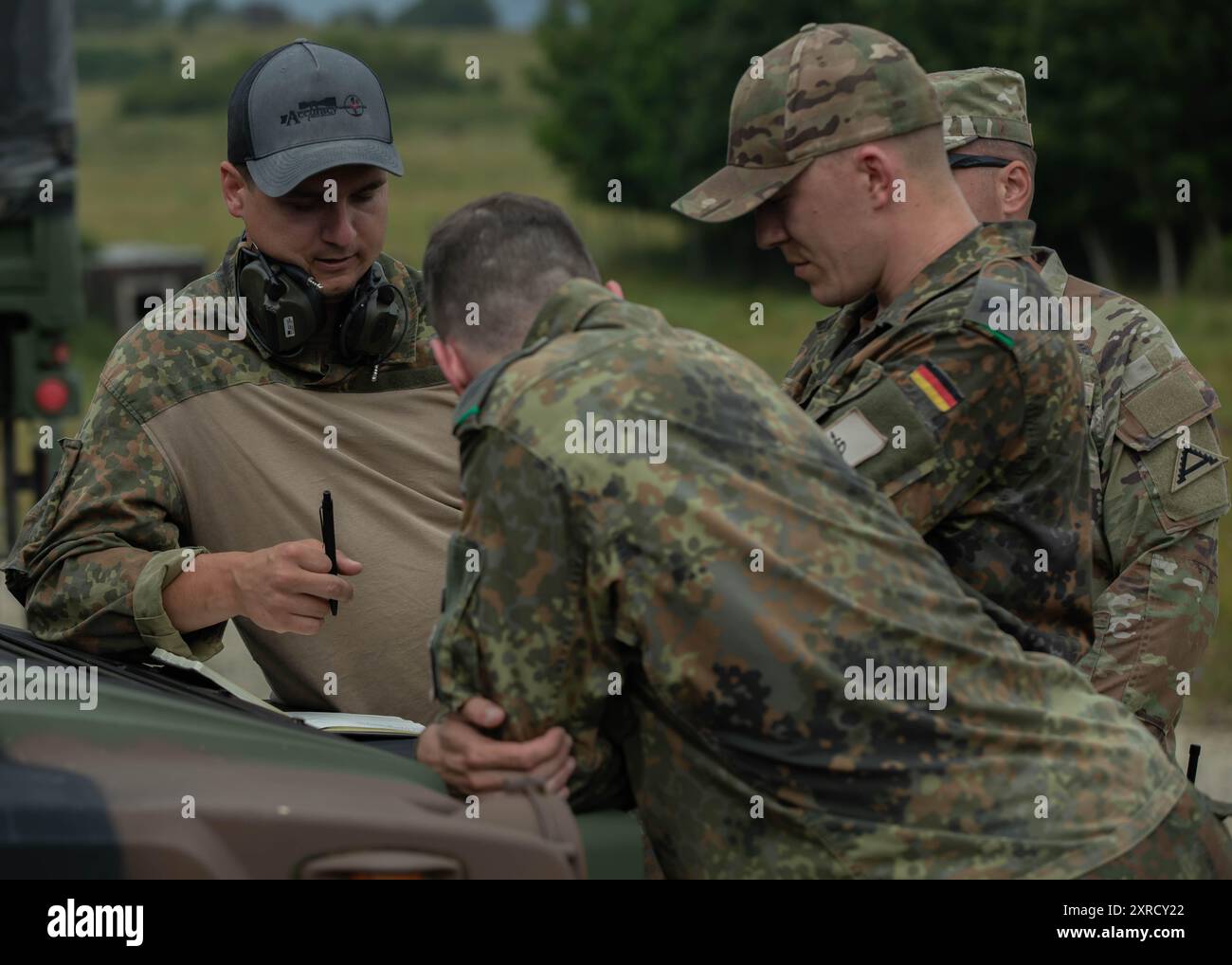 A German sniper team reviews their scorecards during the European Best ...