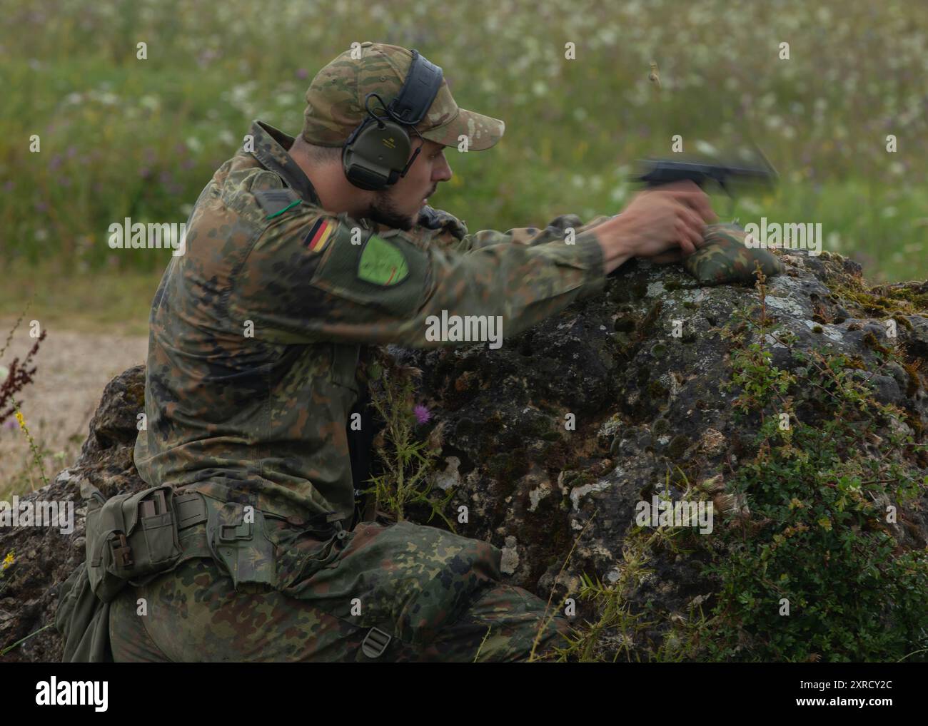 A German soldier shoots a Heckler & Koch P8A1 at a target during the ...