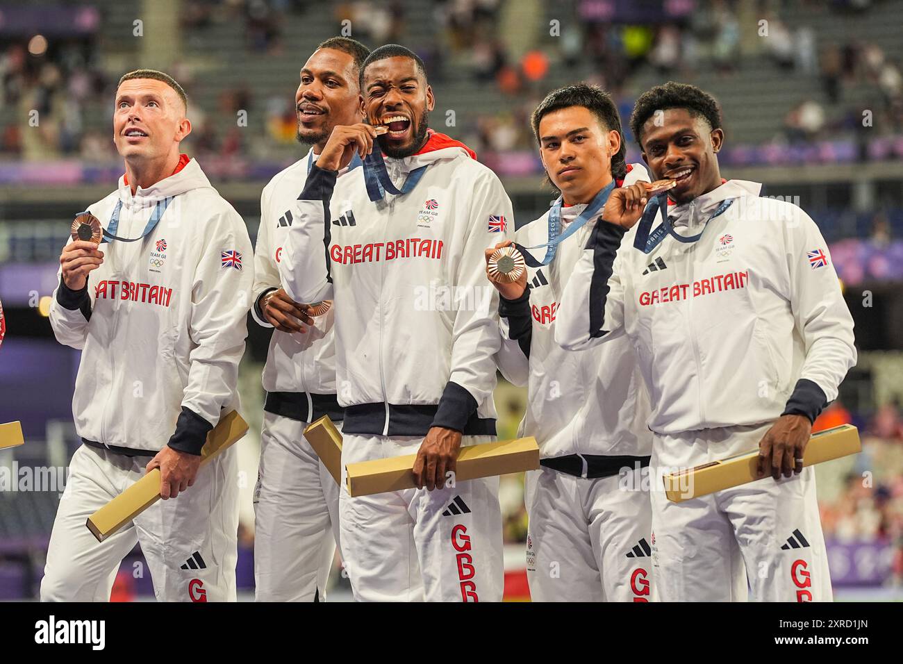 Bronze medalists of Team Great Britain celebrate on the podium after ...
