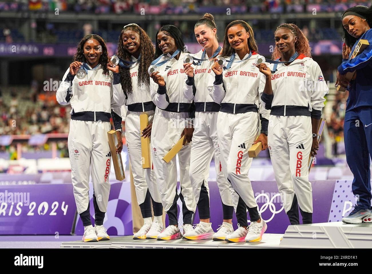 Silver medalists of Team Great Britain celebrate on the podium after ...