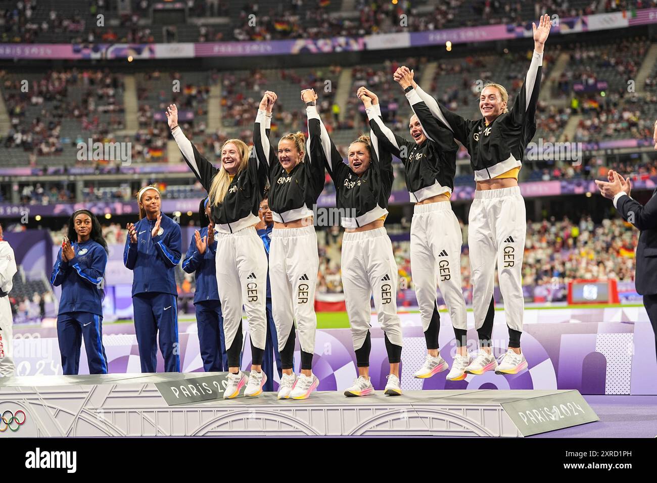 Bronze medalists of Team Germany celebrate on the podium after Women's ...