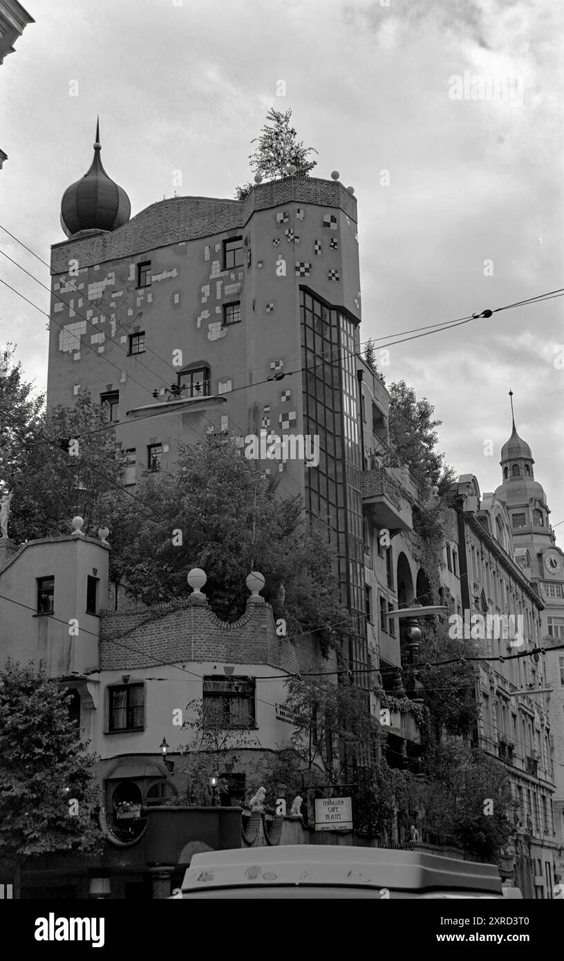 Partial view of the Hundertwasserhaus apartment building in Vienna, Austria, in black and white ...