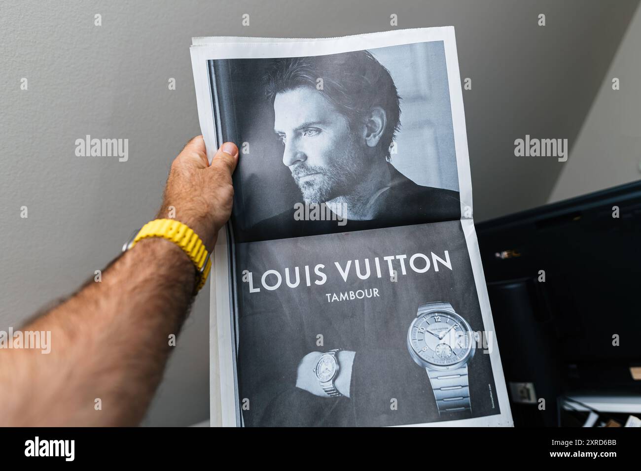 Paris, France - May 20, 2024: A male hand holds a French newspaper ...
