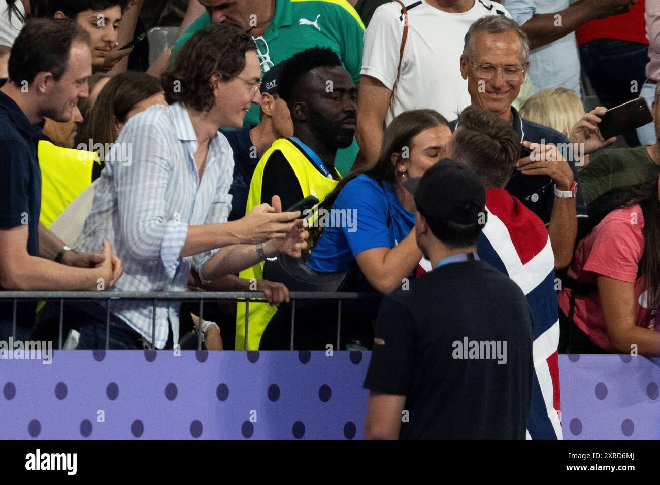 Karsten Warholm of, Norway. , . kisses his girlfriend Oda Djupvik after ...