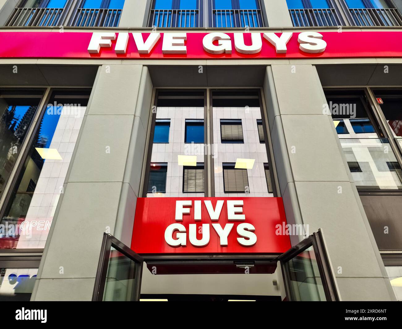 Cologne, Germany - 08 August 2024: The entrance area of a Five Guys ...