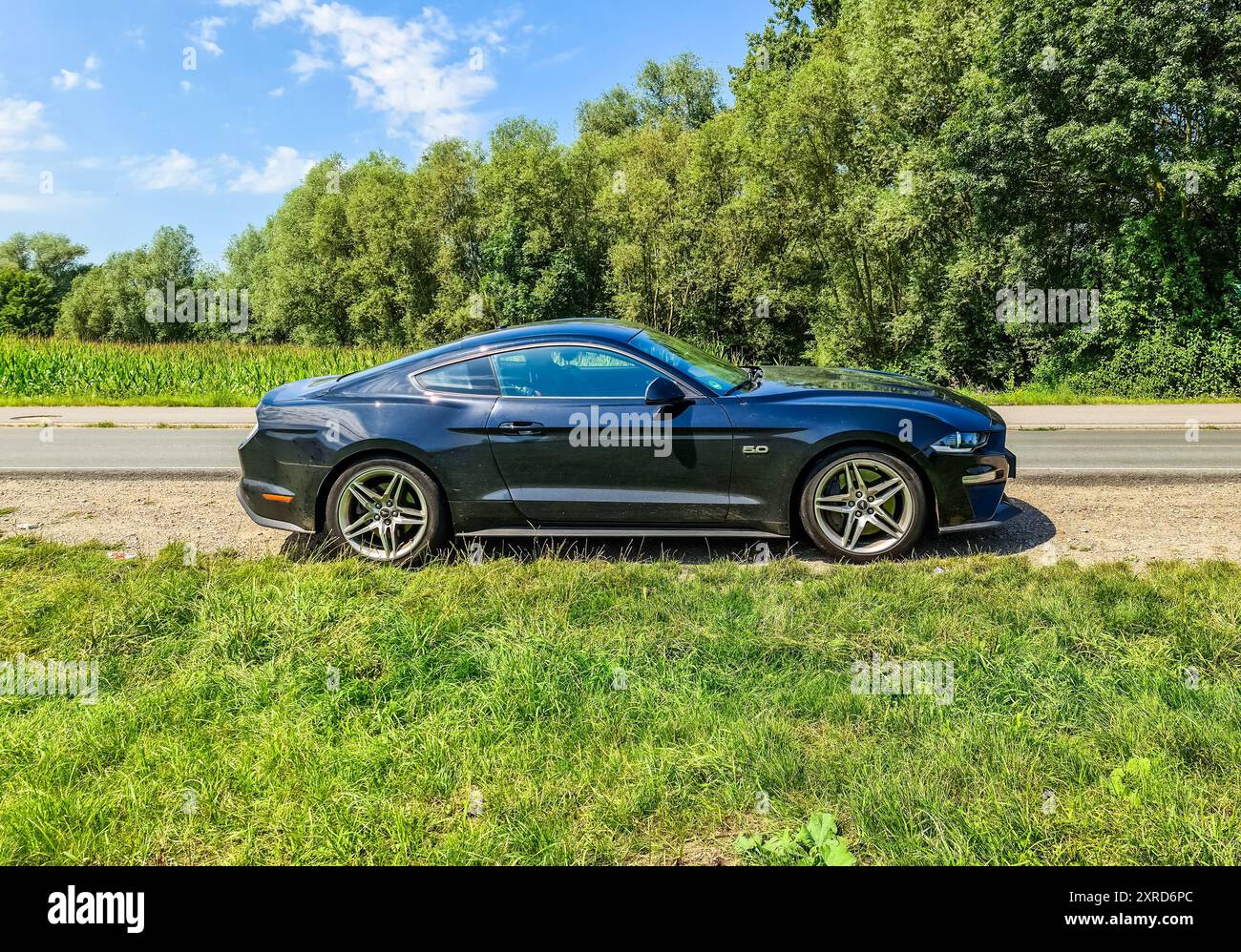 Cologne, Germany - 08 August 2024: A parked black 2018 Ford Mustang on ...