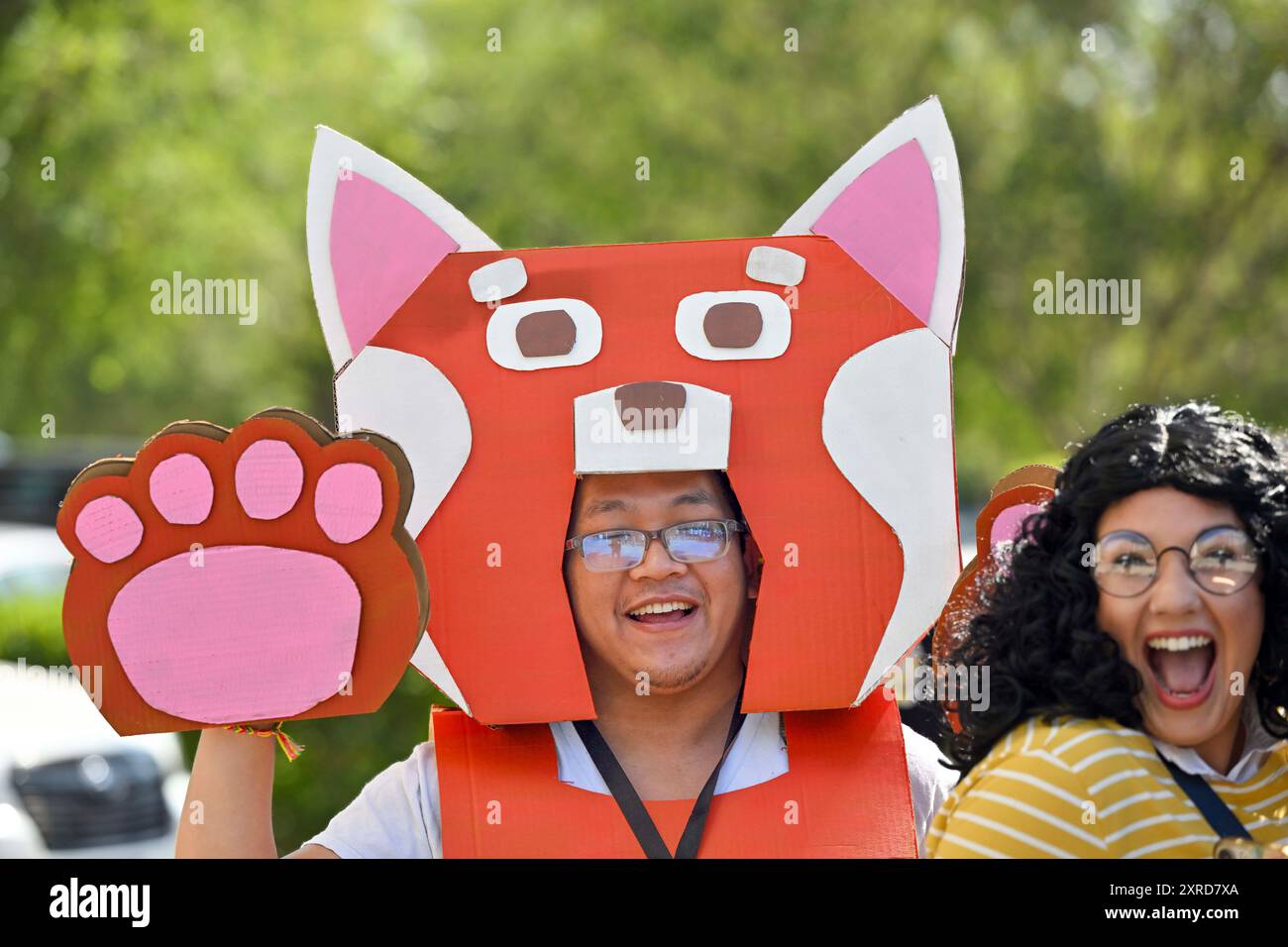 Peter Tran, dressed as Jin Lee from Red Panda as she waits to get into ...