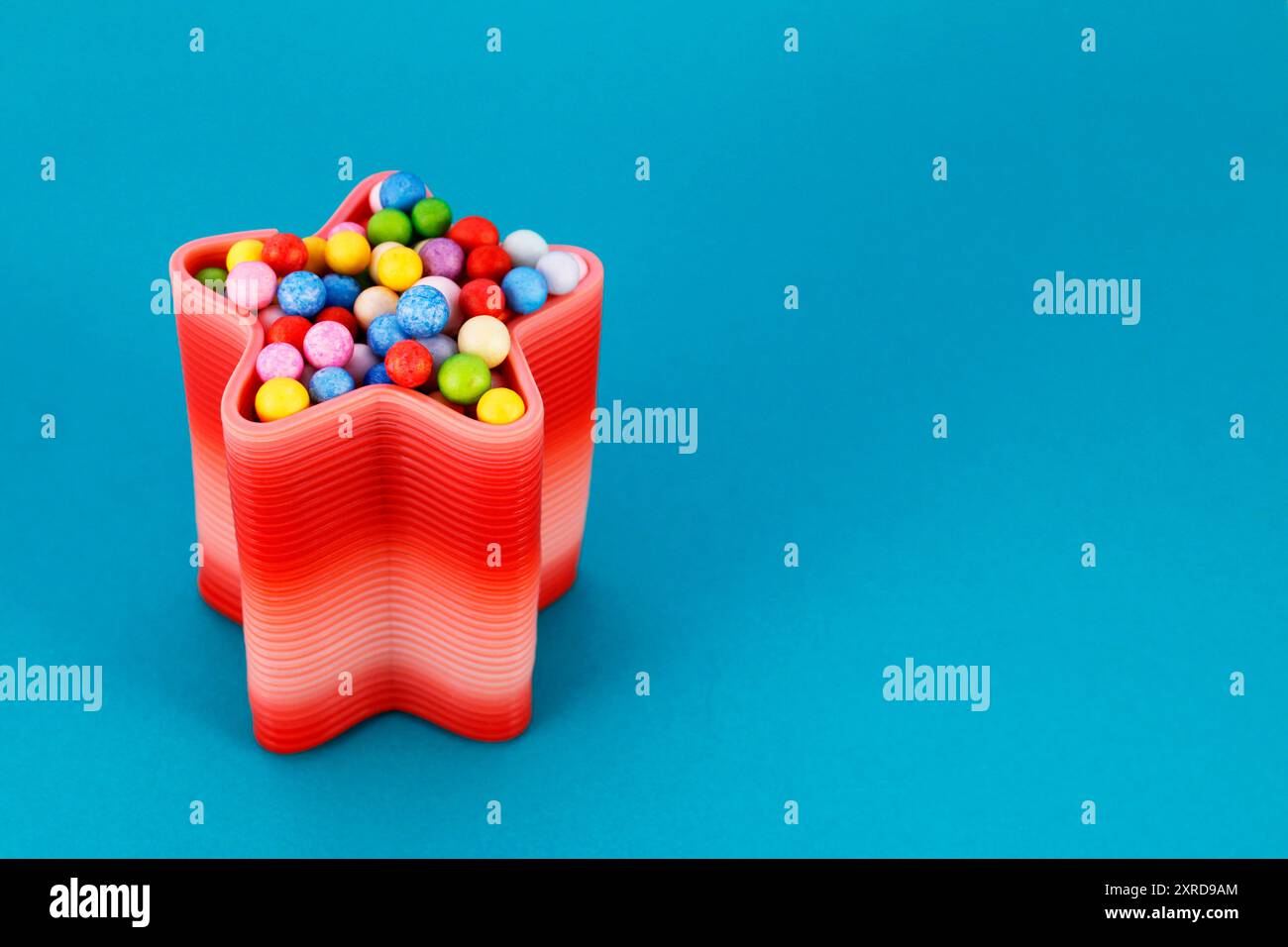 Colorful spheres inside star shaped column Stock Photo - Alamy